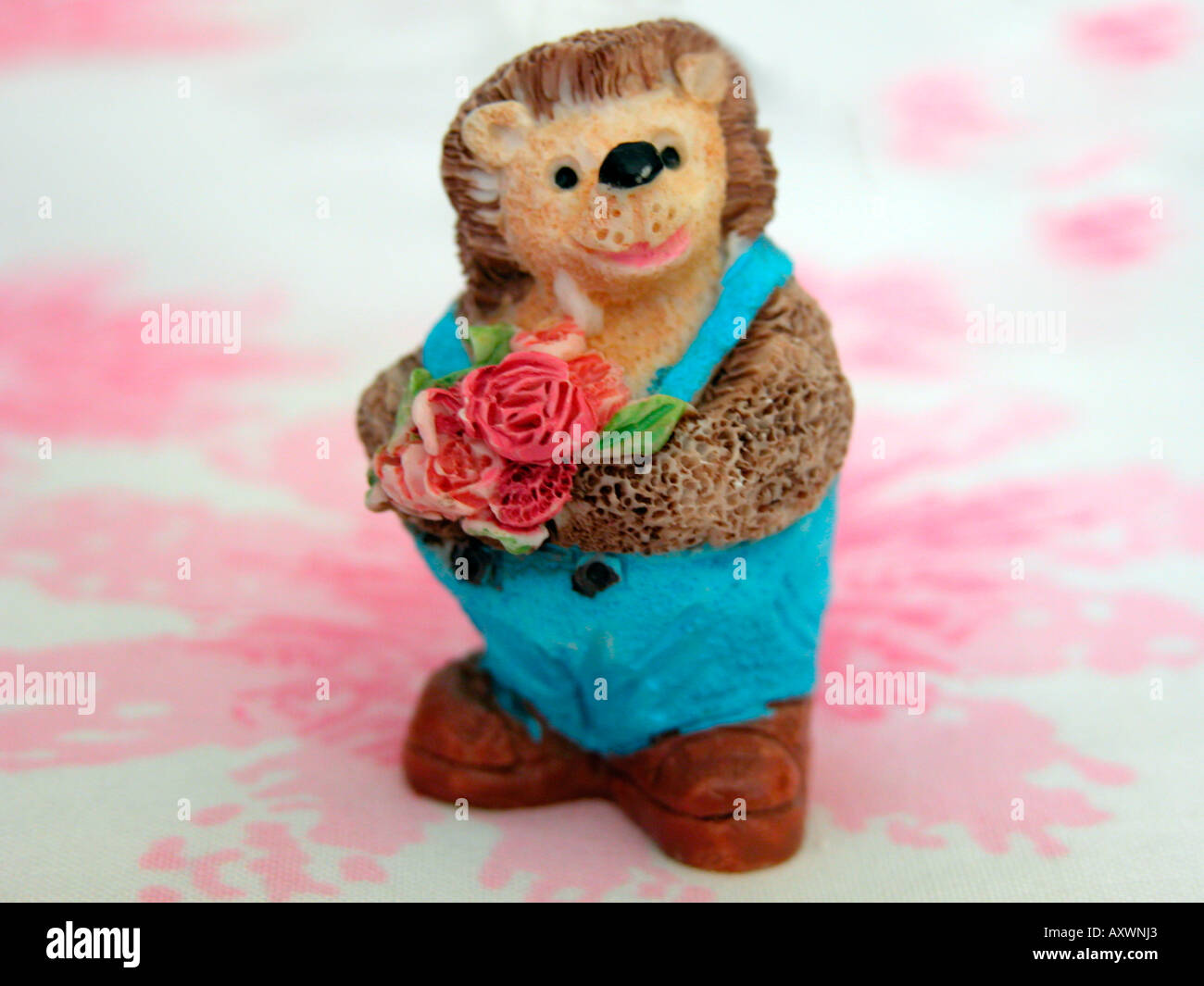 cute ornamental hedgehog with a bunch of flowers Stock Photo - Alamy