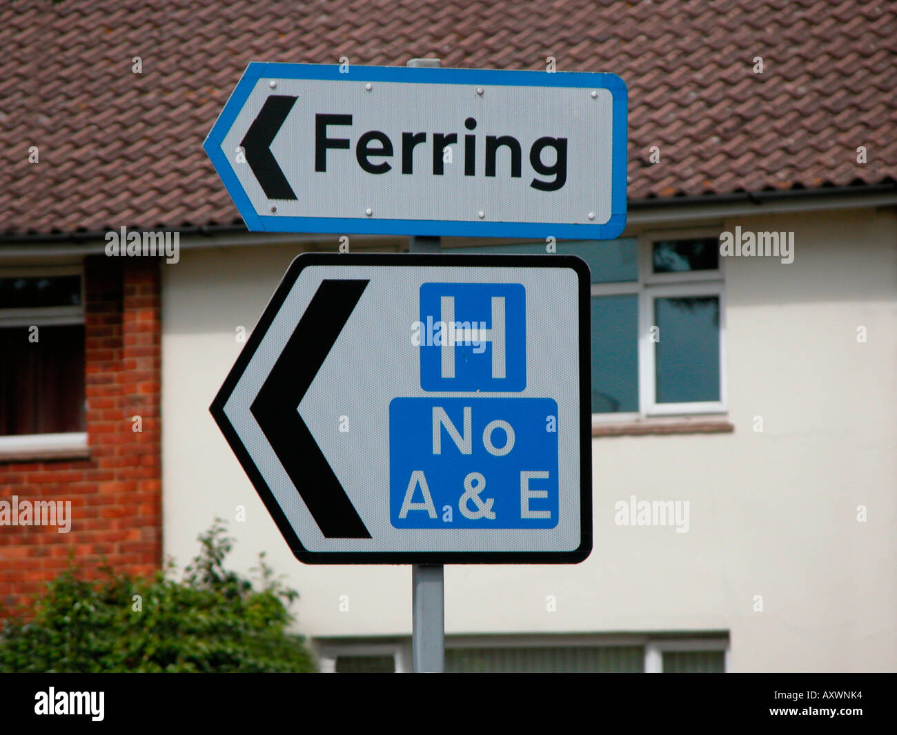 H Hospital sign white on blue background signpost without an a e ...