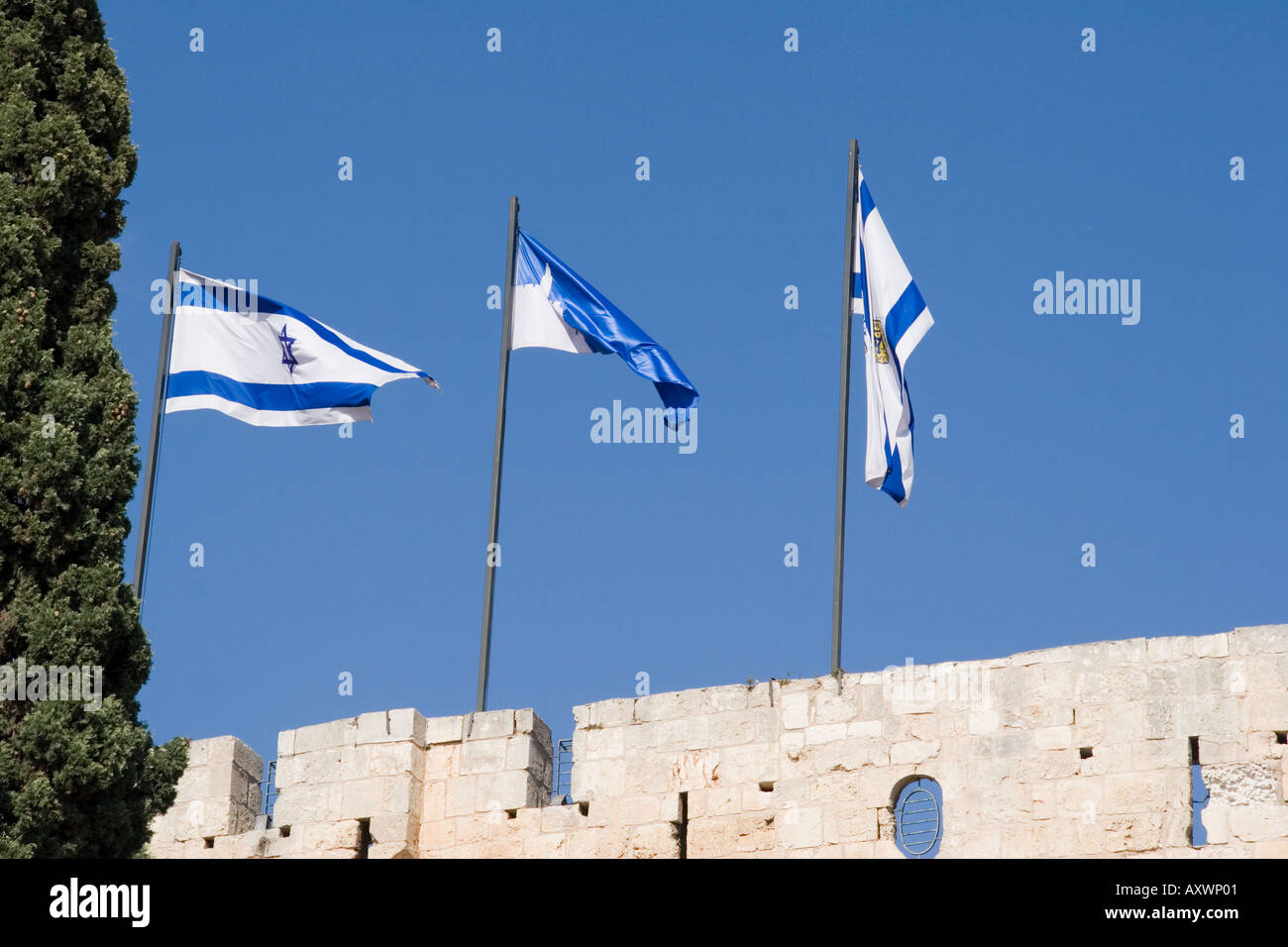 Israeli flags fluttering in the wind over the Jerusalem Old-City walls ...