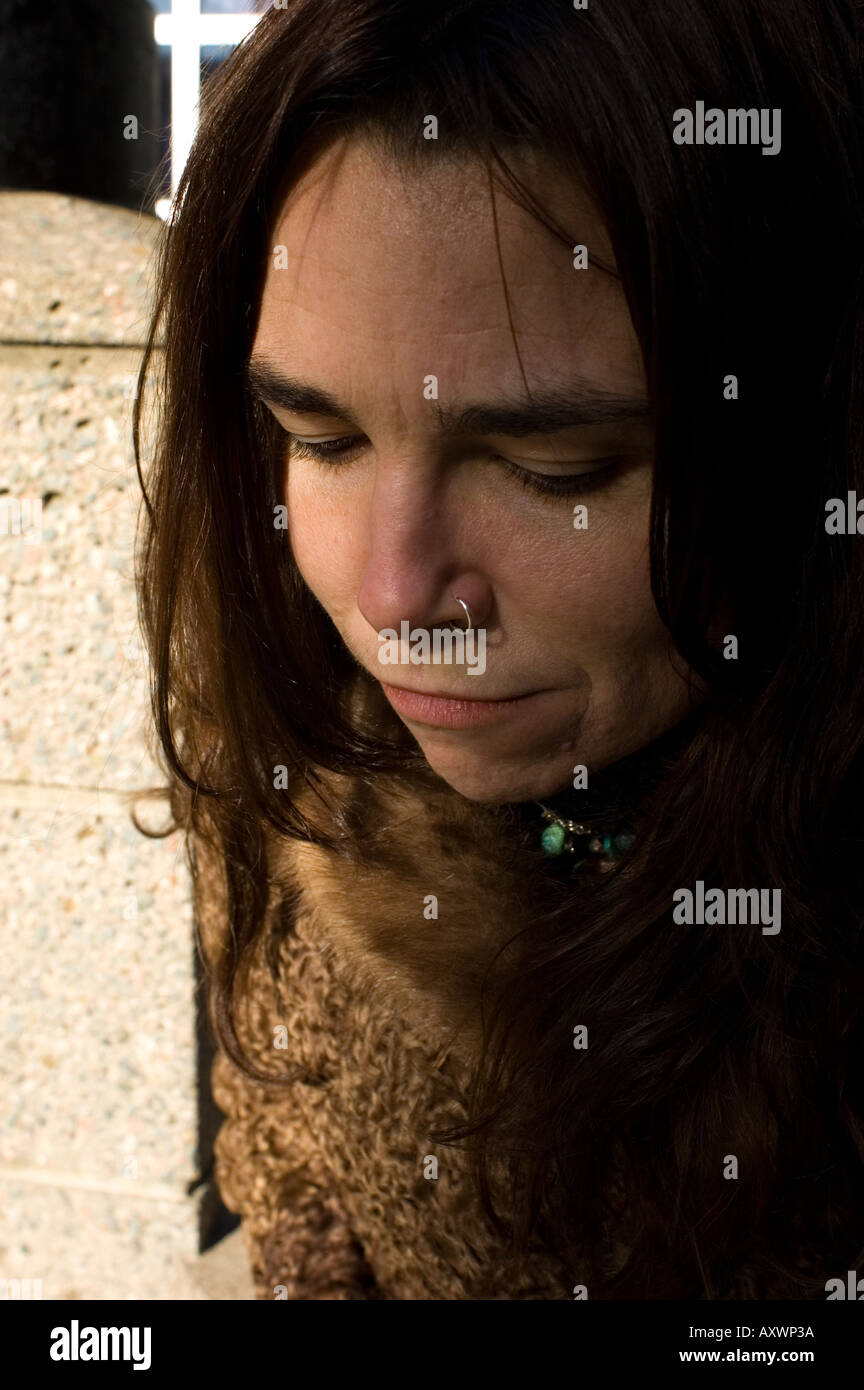 woman with long hair looking downcast in Saint John, New Brunswick ...