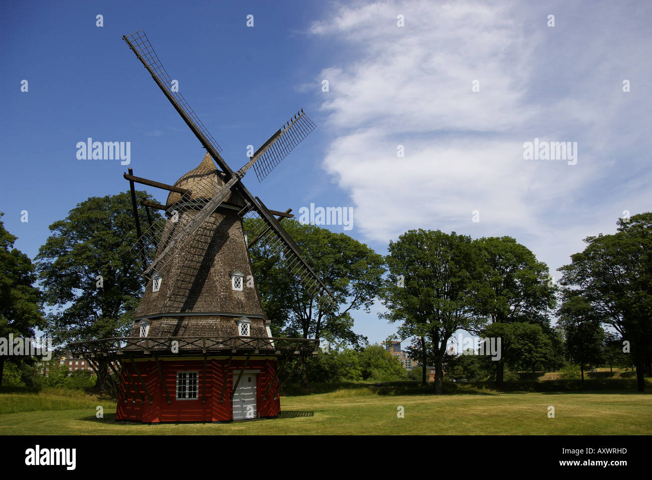 Old Swedish windmill with trees and clear blue sky background in Skane ...