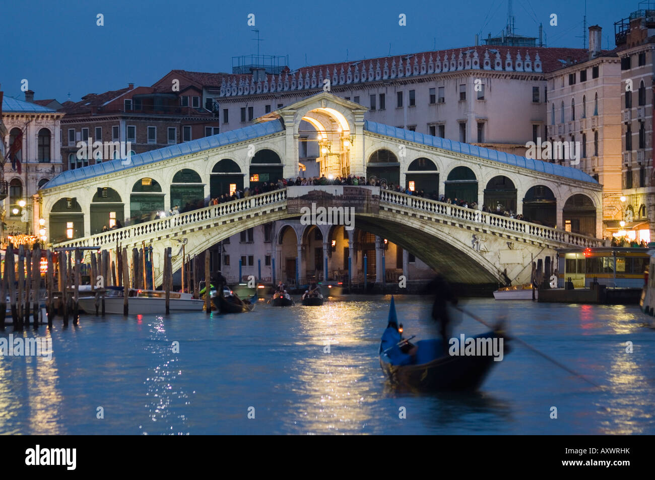 The Grand Canal, the Rialto Bridge and gondolas at night, Venice ...