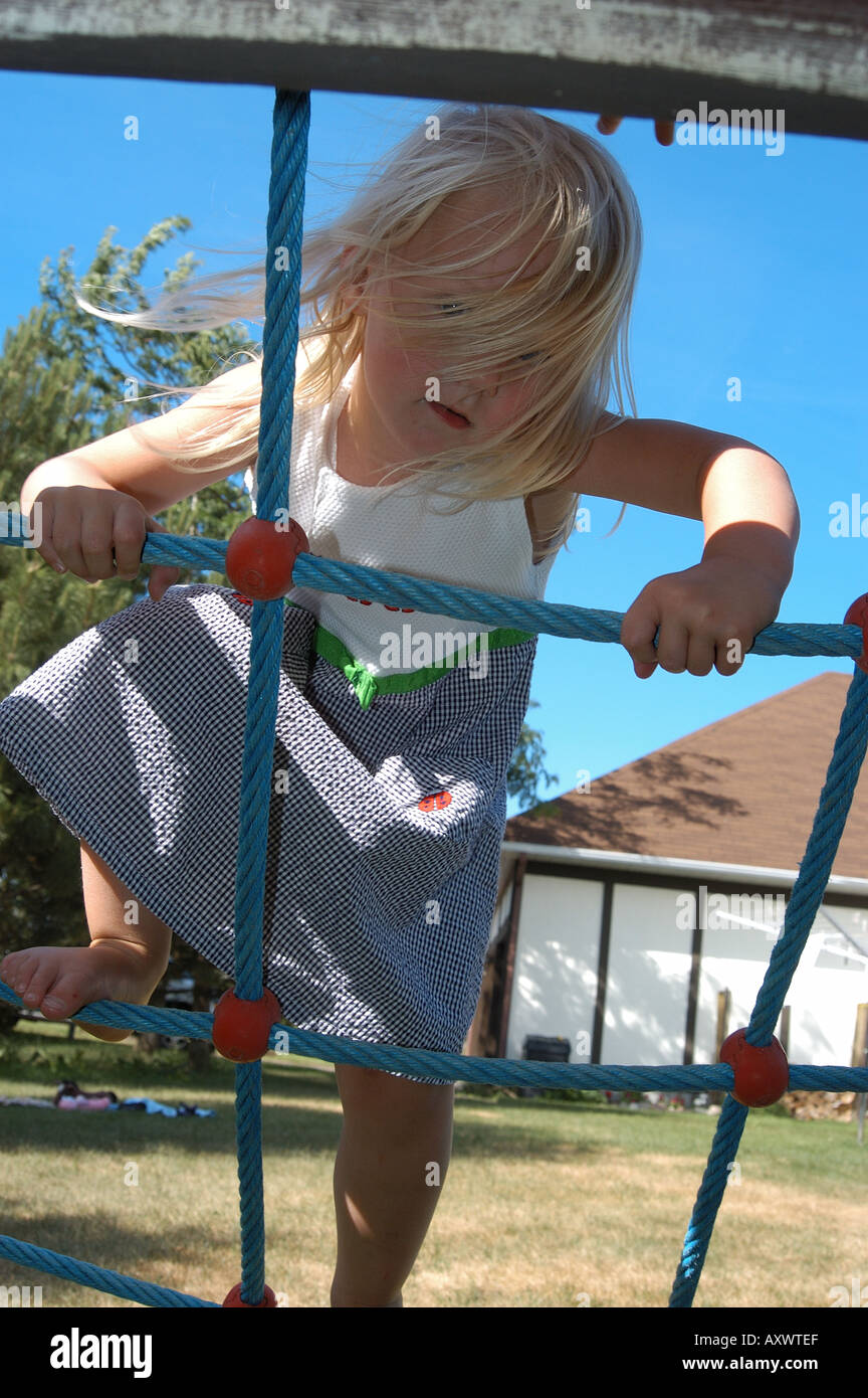 girl climbing play structure Stock Photo - Alamy