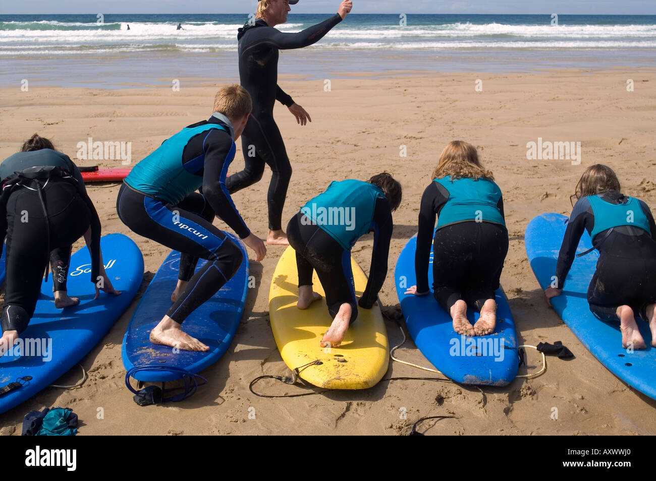 Surf school practising skills on the beach, Watergate Bay, Cornwall ...