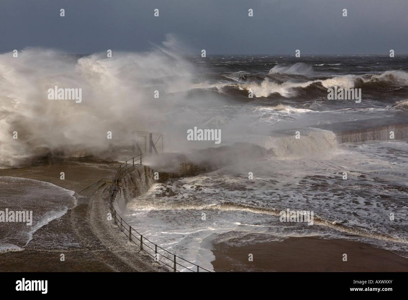 A violent and severe gale blows huges waves through the locked gates of ...