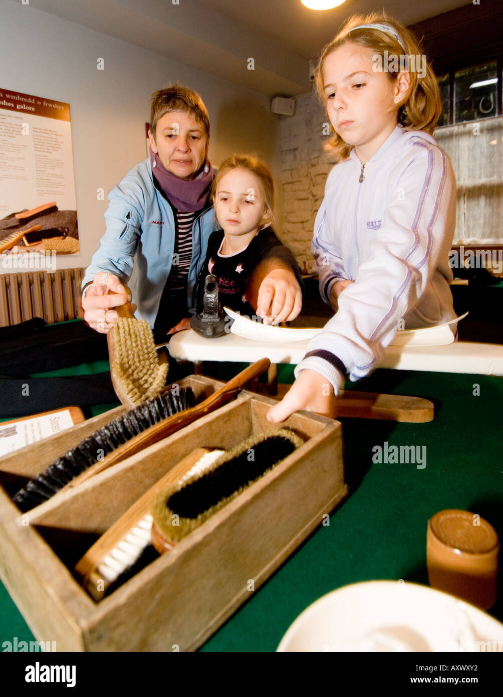 Mother and two daughters looking at display items in the servants ...