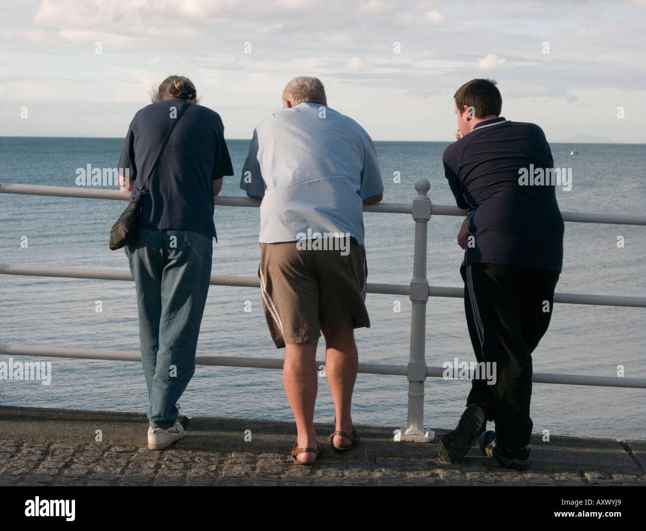 Man looking over railings hi-res stock photography and images - Alamy