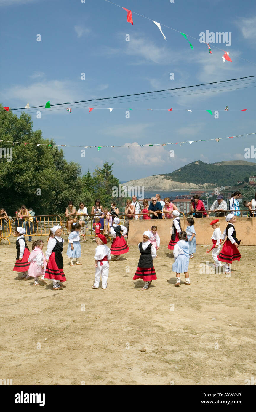 Young Basque children perform traditional Basque folk dance fiesta ...