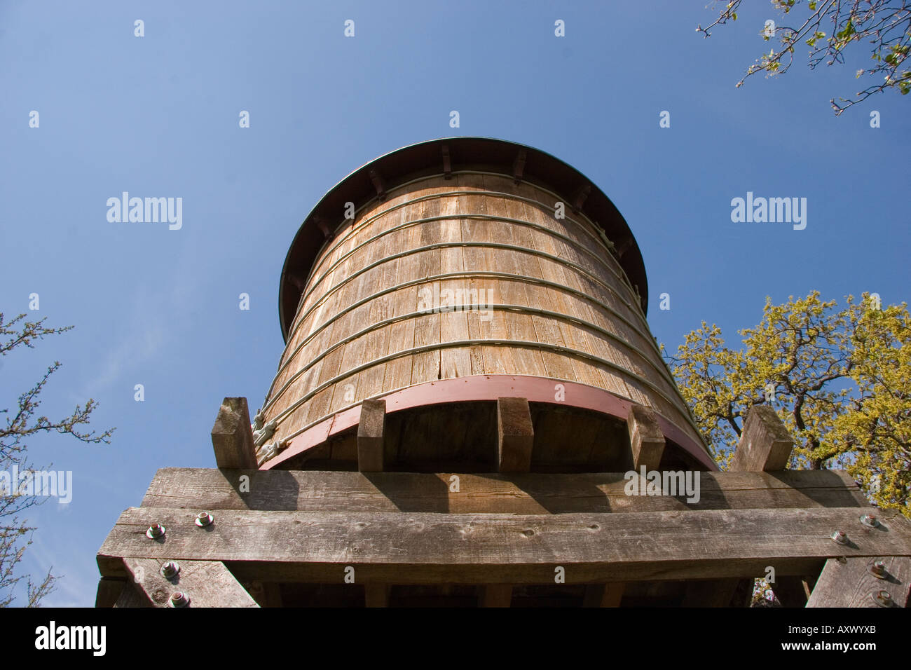 Old Fashion Wooden Water Tower sits on wood platform, historically ...