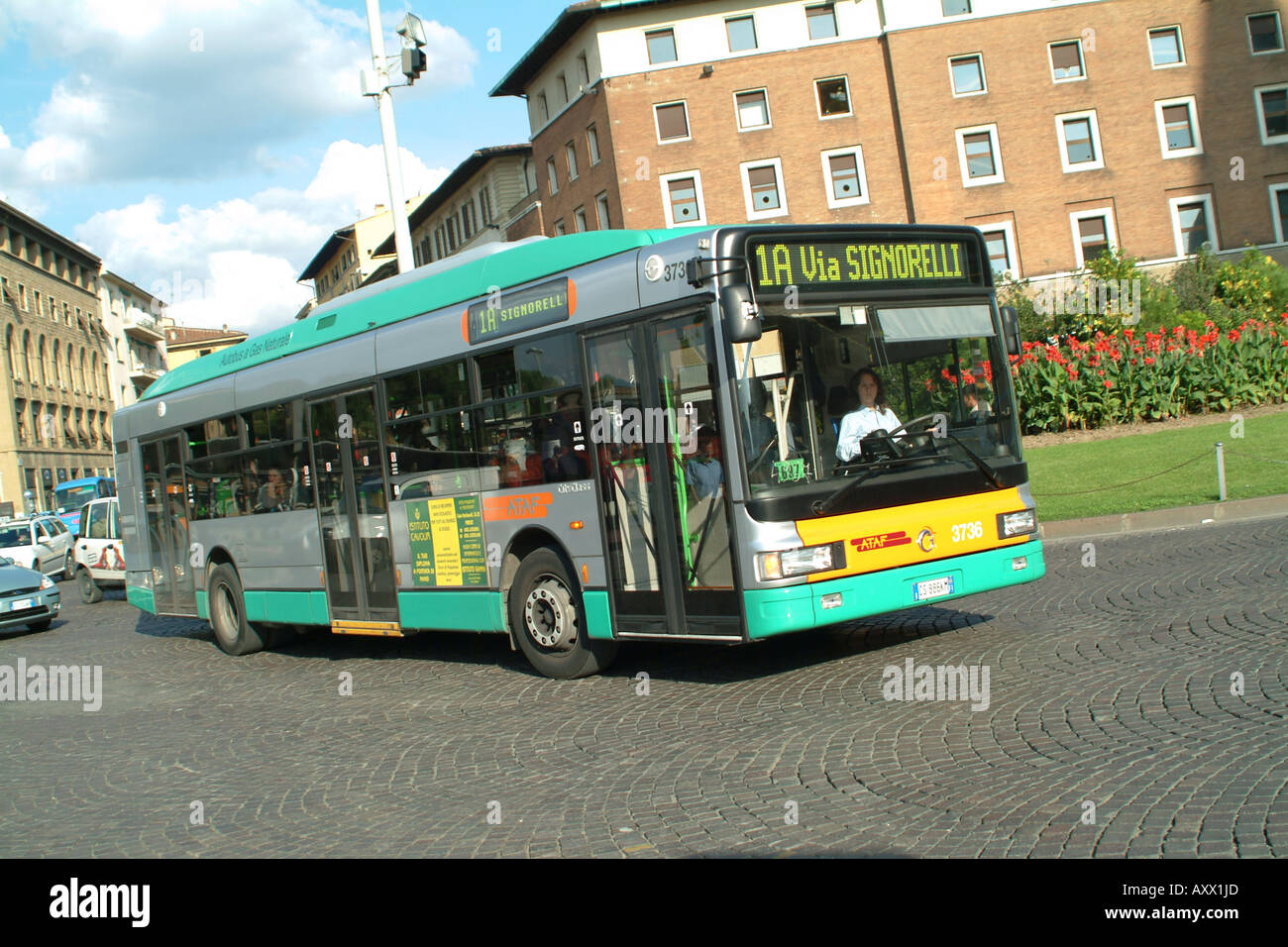 A gas powered bus makes its way through the streets of Florence ...