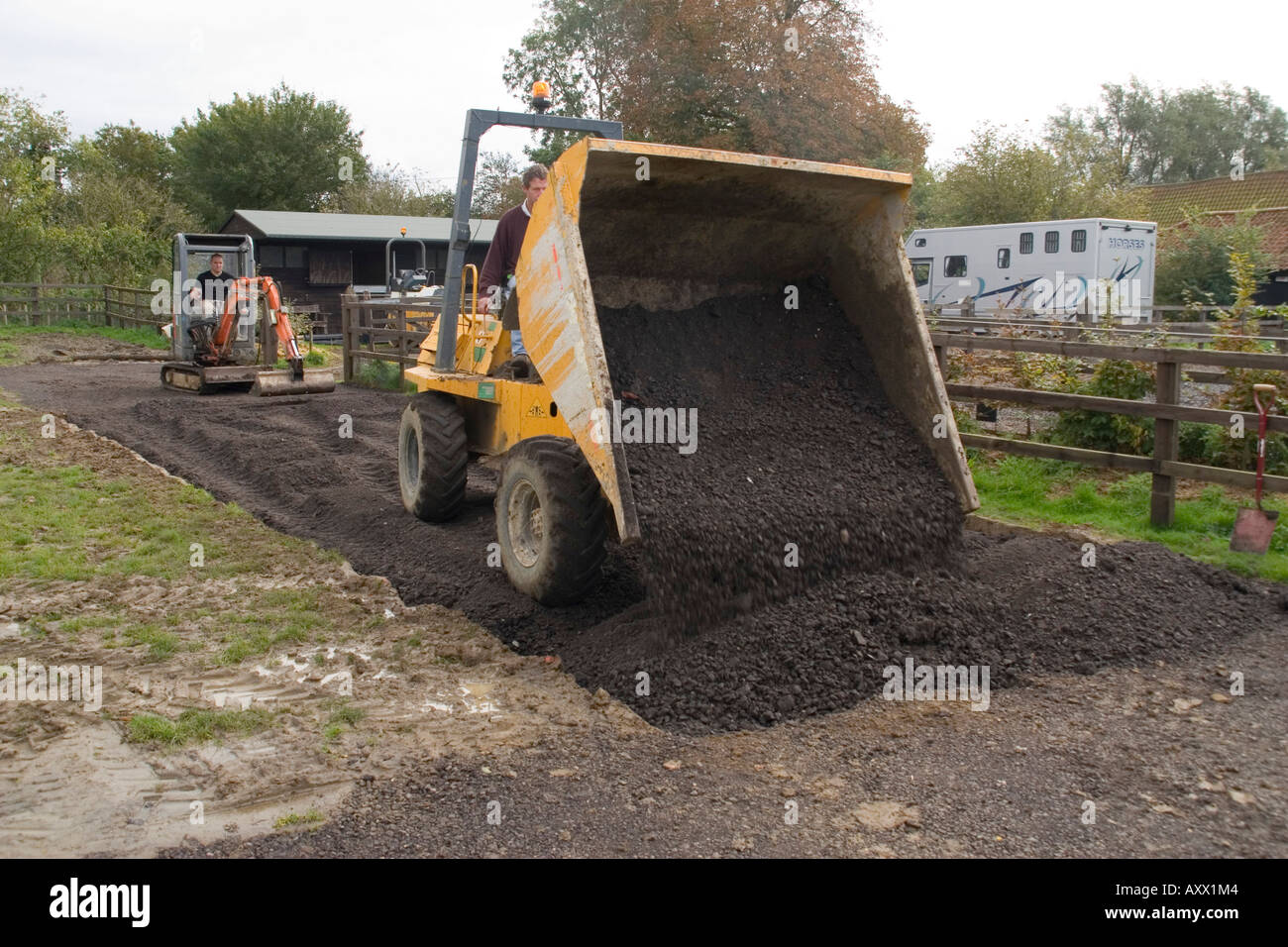 tipper with road chipping for hard standing Stock Photo - Alamy