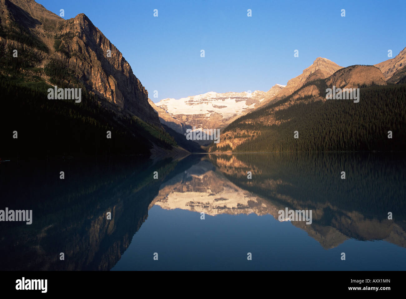 View to Mount Victoria across the still waters of Lake Louise, at ...