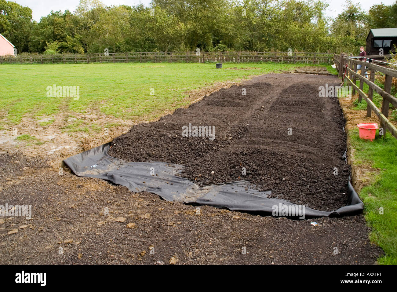 Hard standing of old road chippings Stock Photo - Alamy