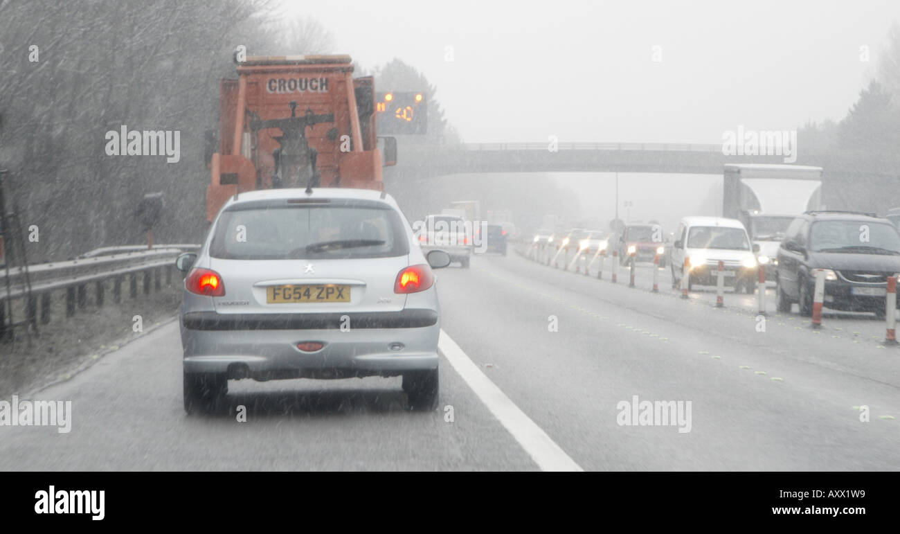 Driver's eye view of traffic driving slowly through a contraflow on the ...