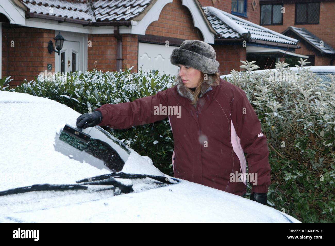 Icy windscreen woman scraping hi-res stock photography and images - Alamy
