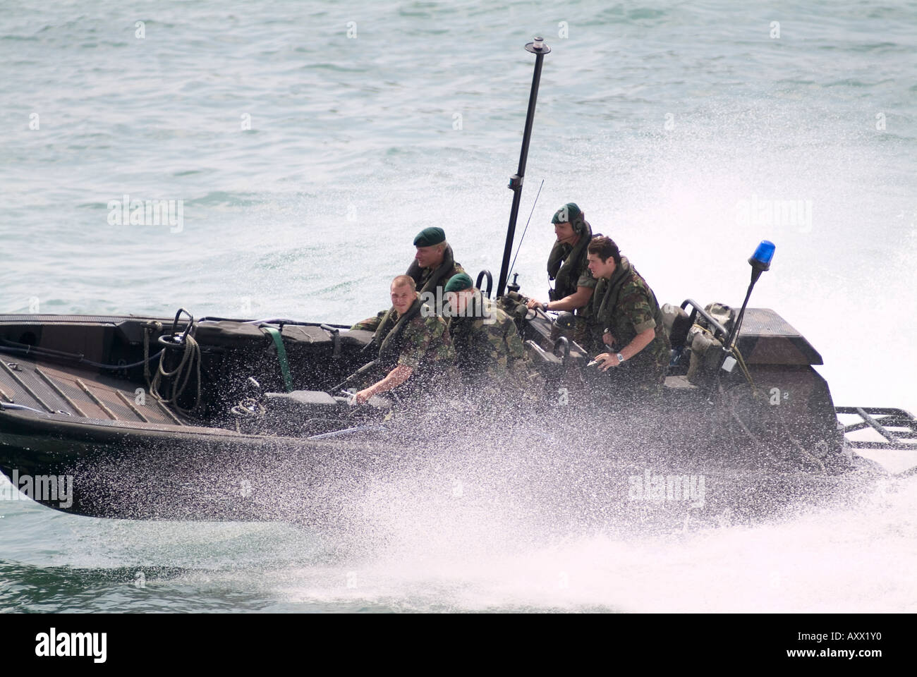 Royal Marines in fast response boat Stock Photo - Alamy