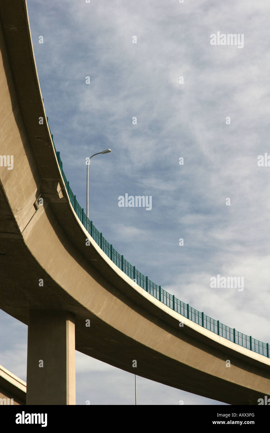 Freeway overpass curves into the distance Stock Photo - Alamy