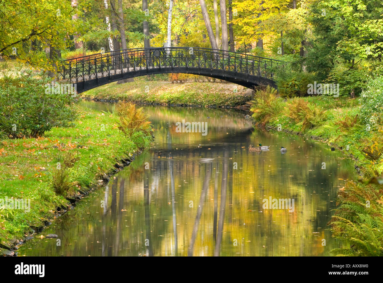 Wroclaw Bridge over quiet autumn water Park Szczytnicki Poland fall ...