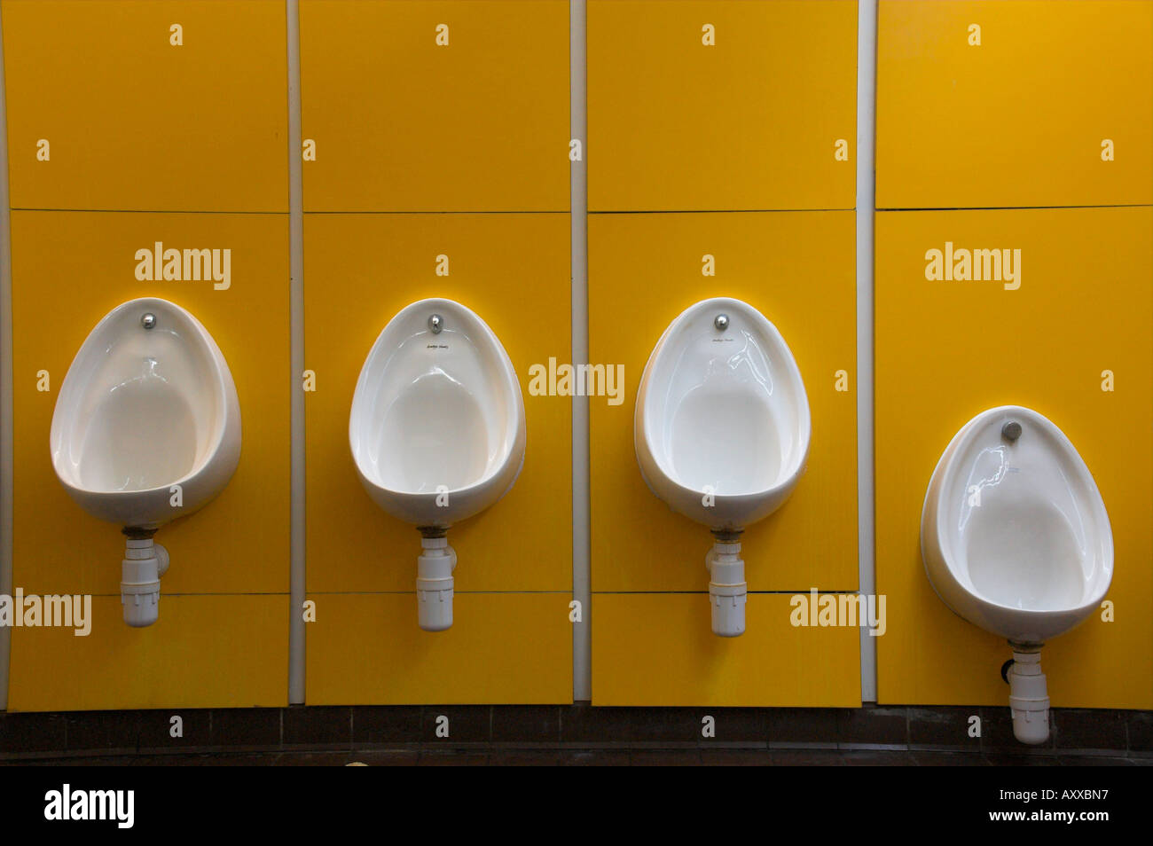 public urinal with yellow wall Stock Photo - Alamy