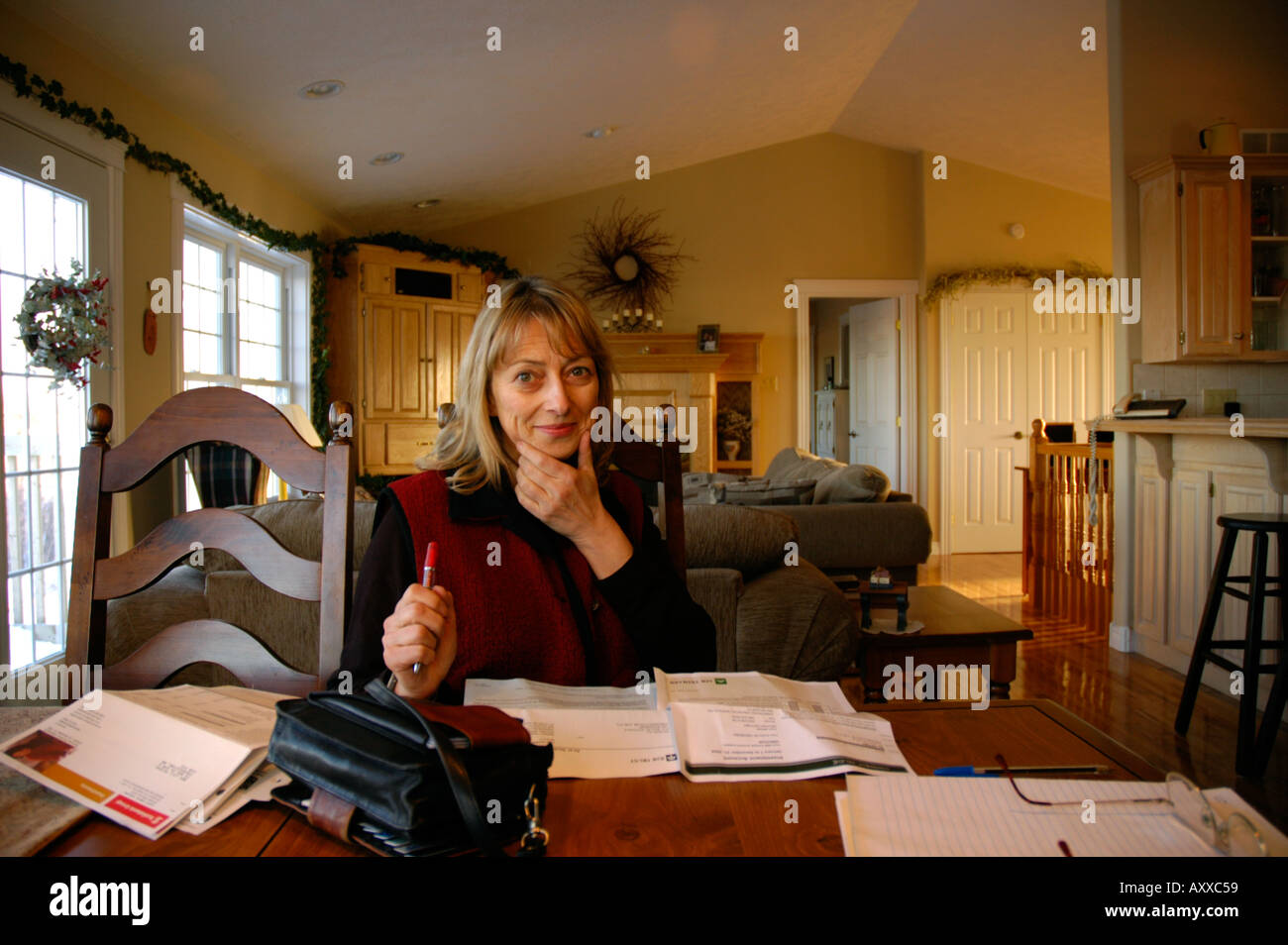 Middle aged woman planning for retirement and financial planning Stock ...