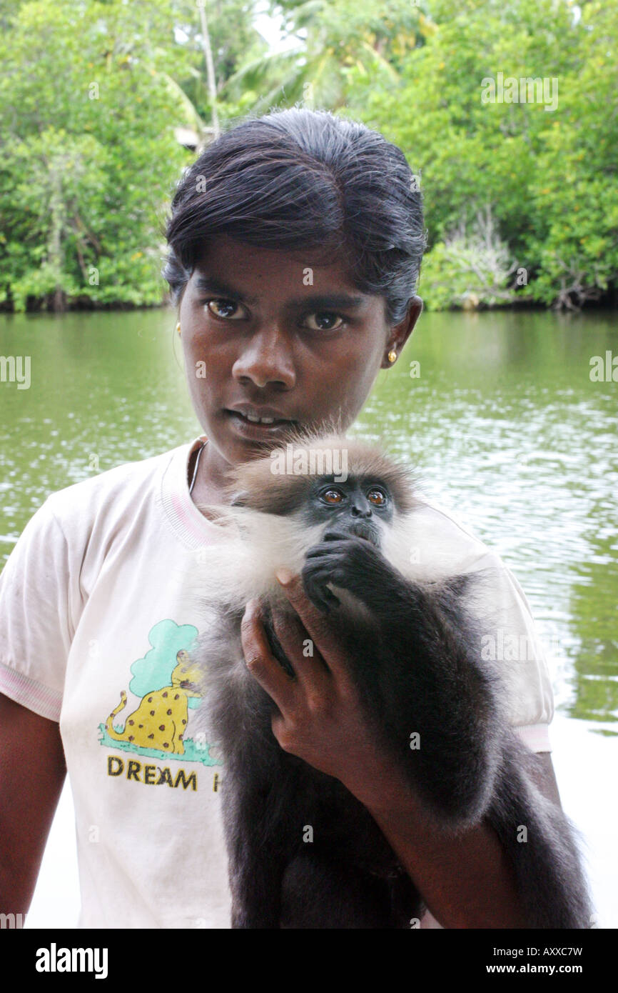 Sri lanka teenager girl shows off her pet langur monkey to earn money ...