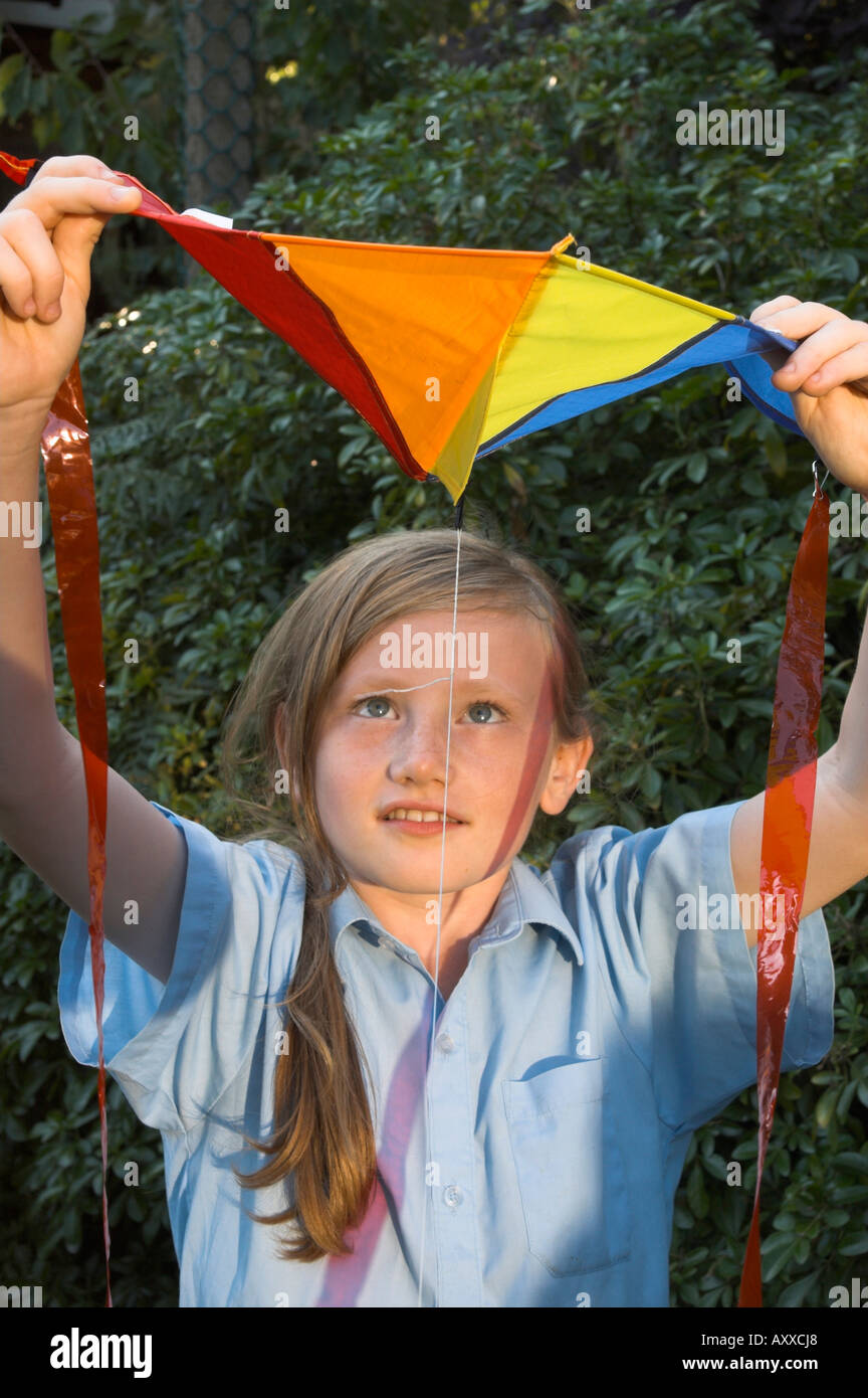 girl child watching paper kite portrait Stock Photo - Alamy