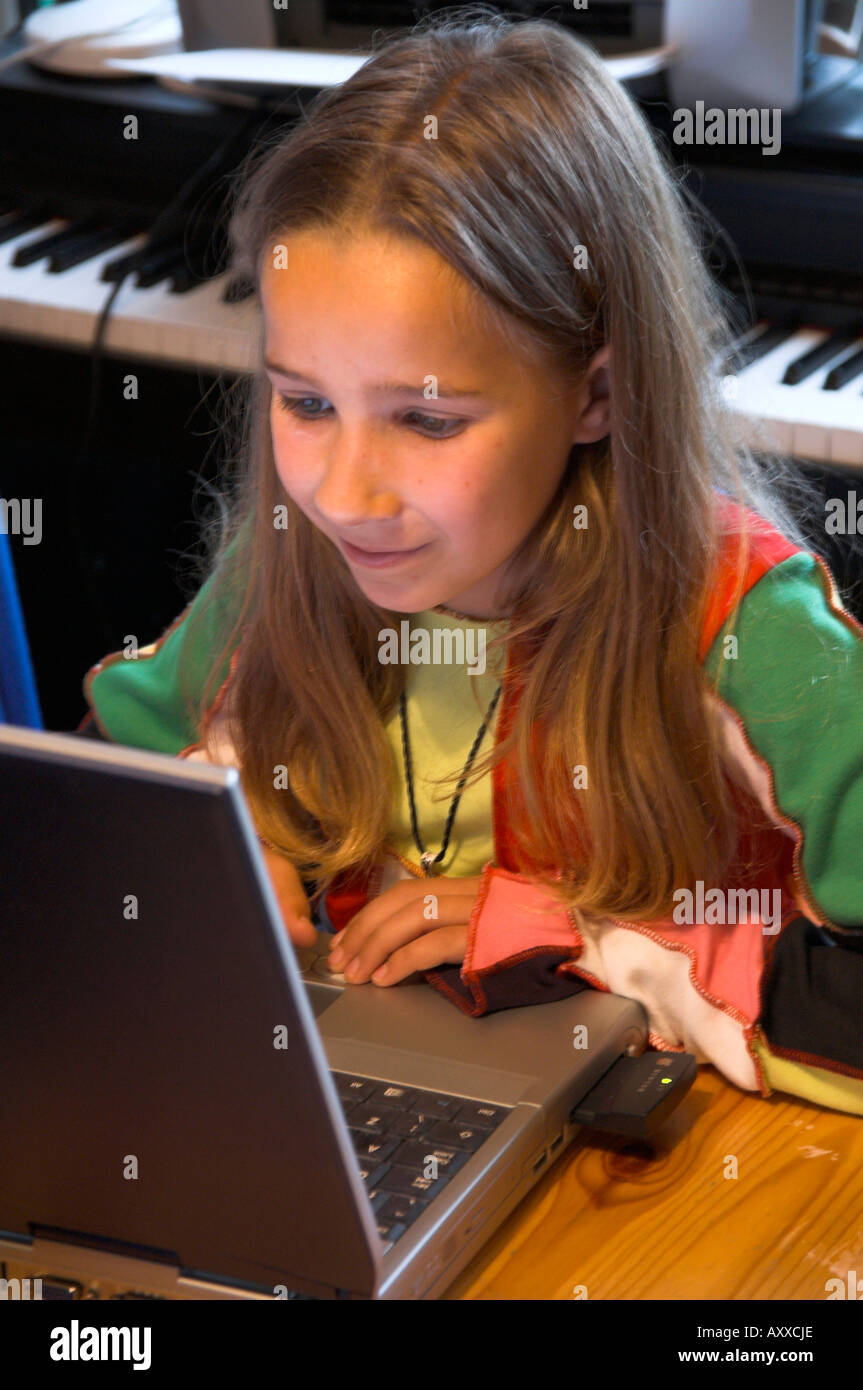 girl child working with laptop computer Stock Photo - Alamy