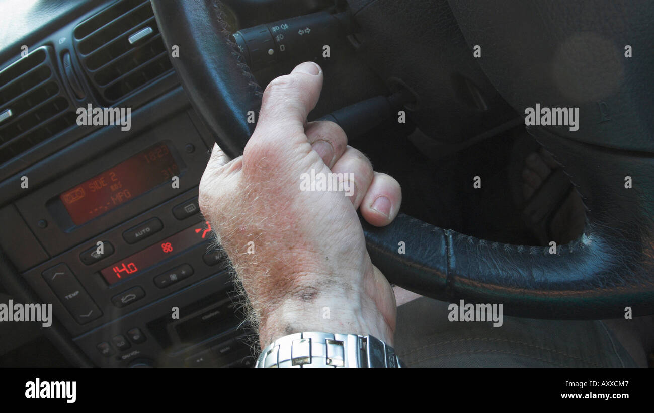 hand on car control steering wheel Stock Photo - Alamy