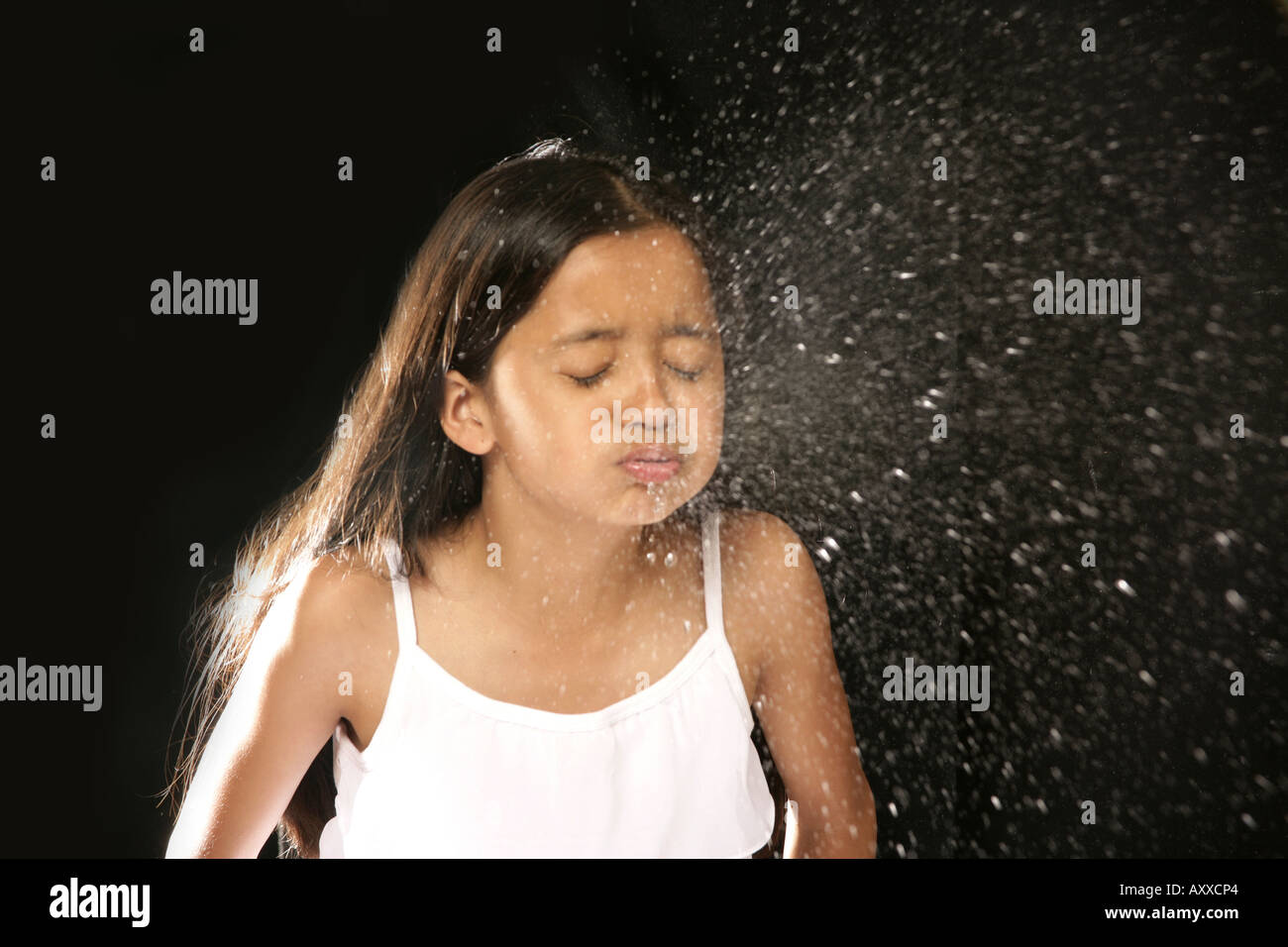 Young girl sneezing, spreading germs Stock Photo - Alamy