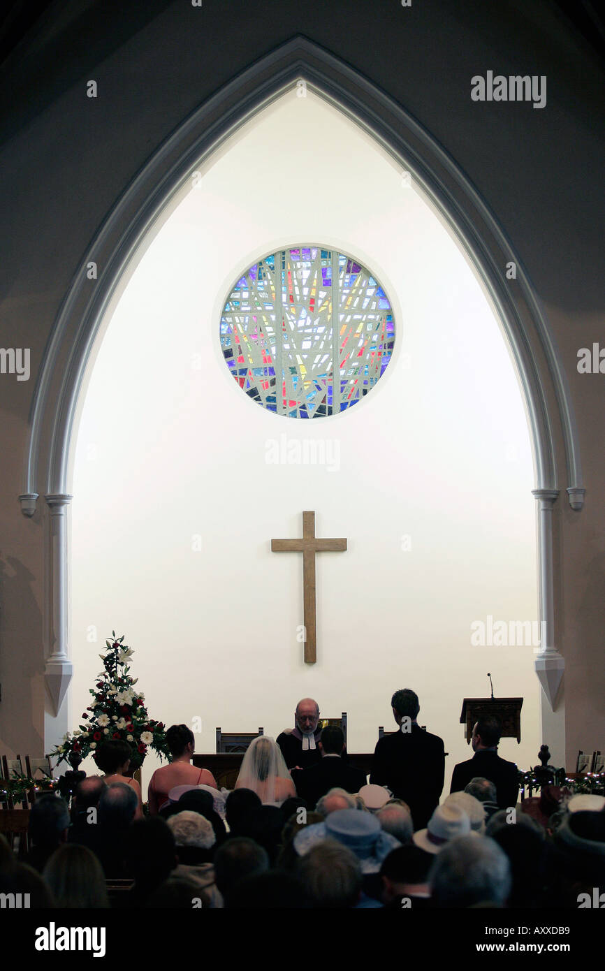 Christian cross and stained glass inside a church Stock Photo - Alamy