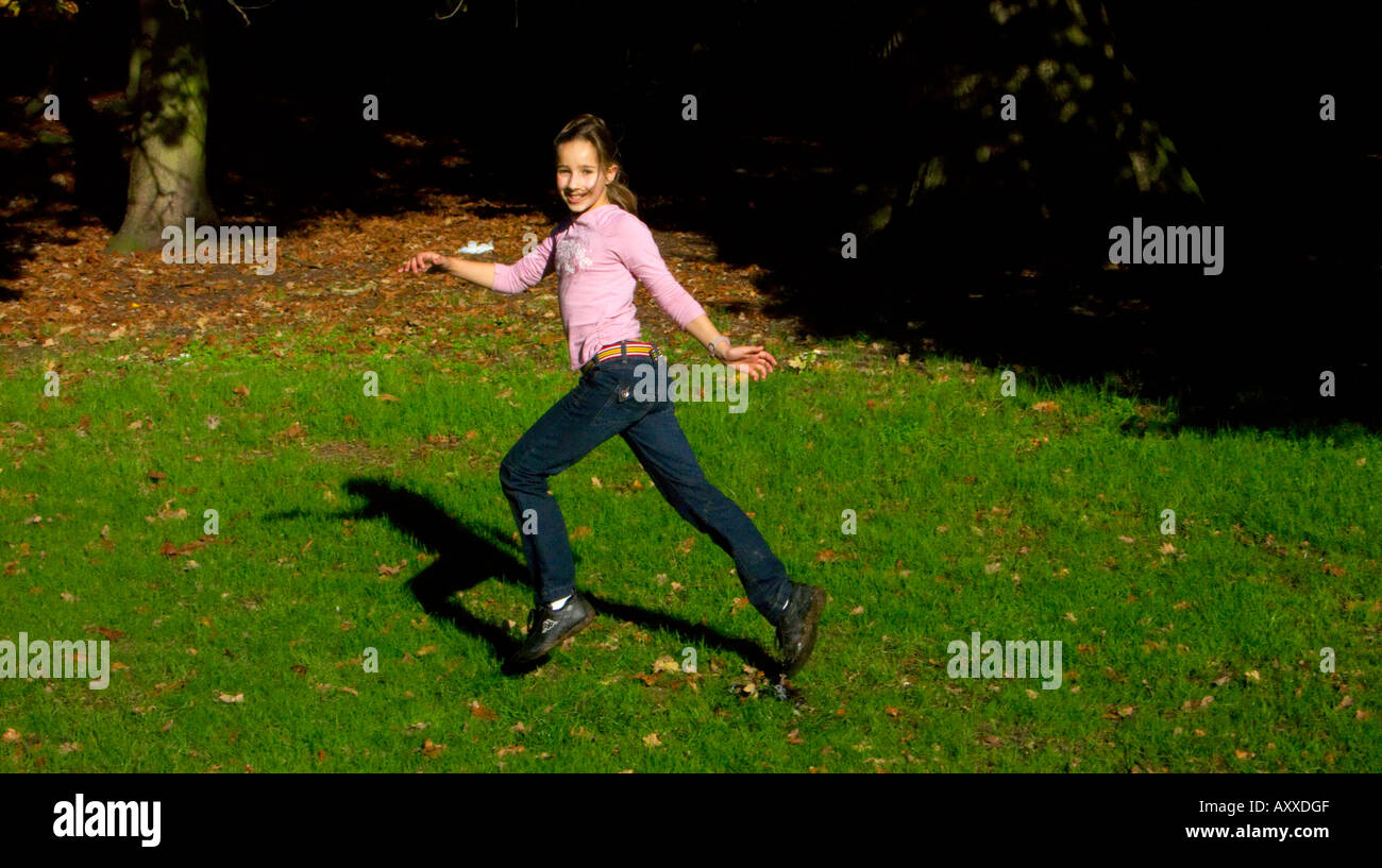 girl child running and smiling Stock Photo - Alamy