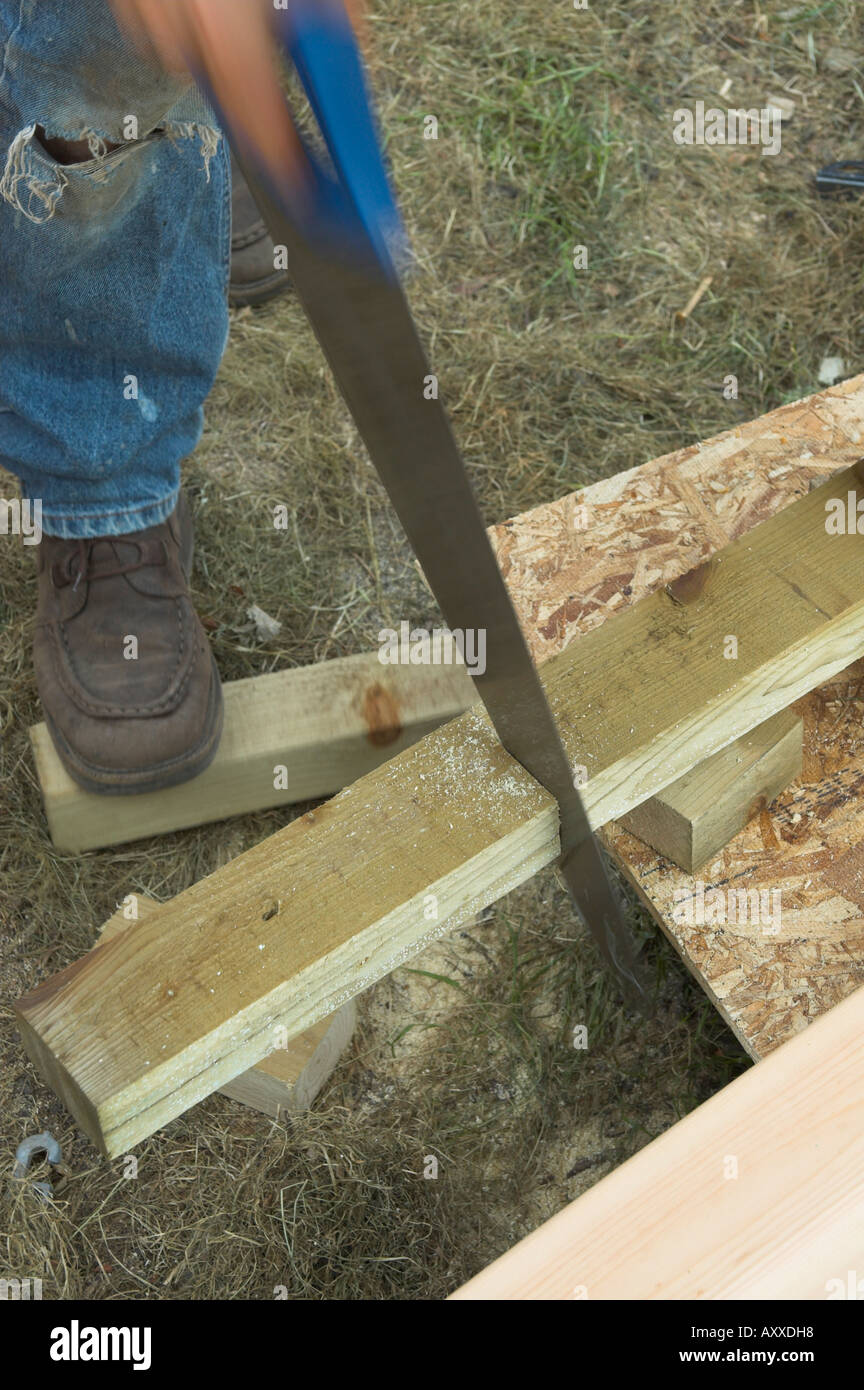 man sawing timber Stock Photo - Alamy
