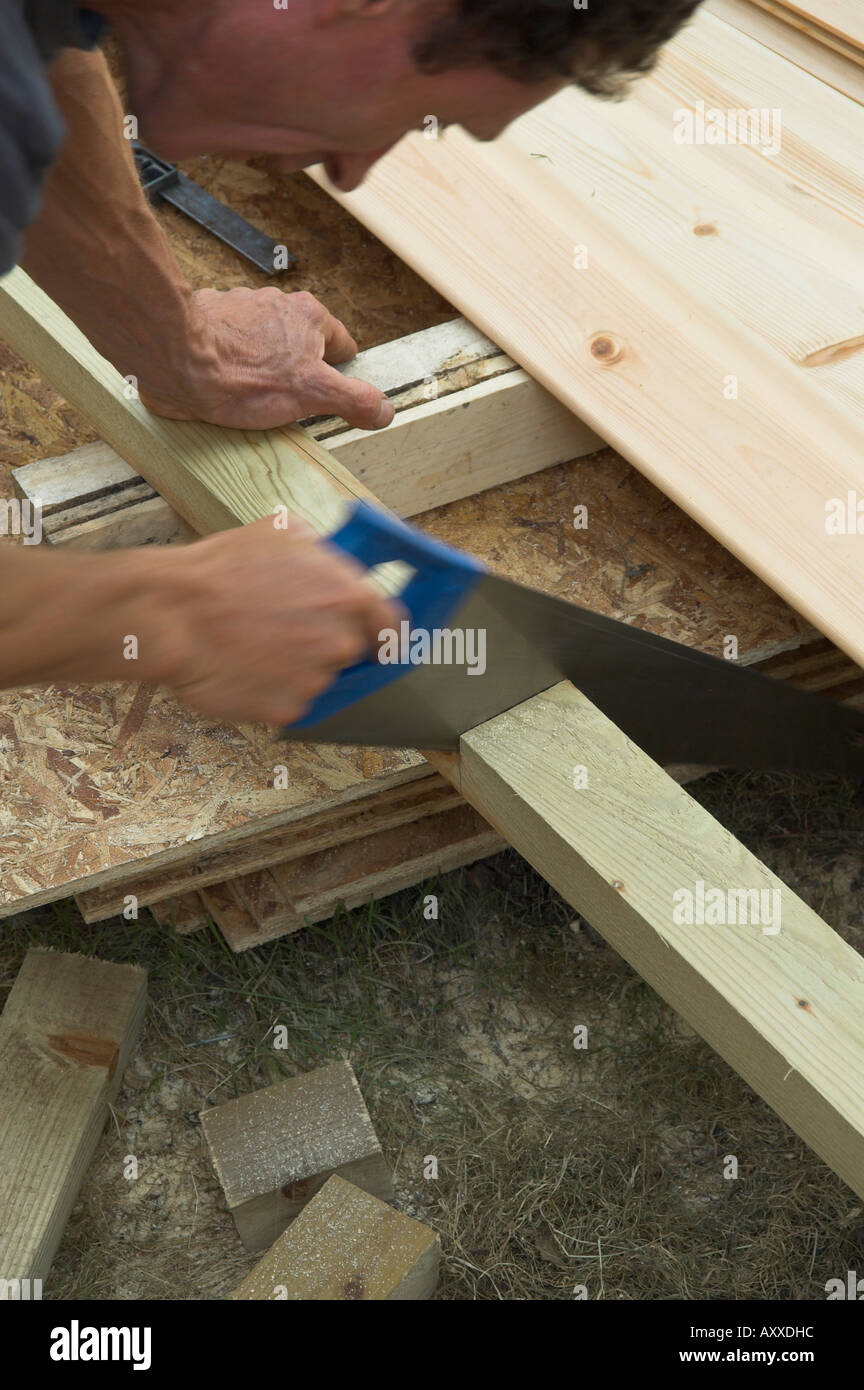 man sawing timber Stock Photo - Alamy