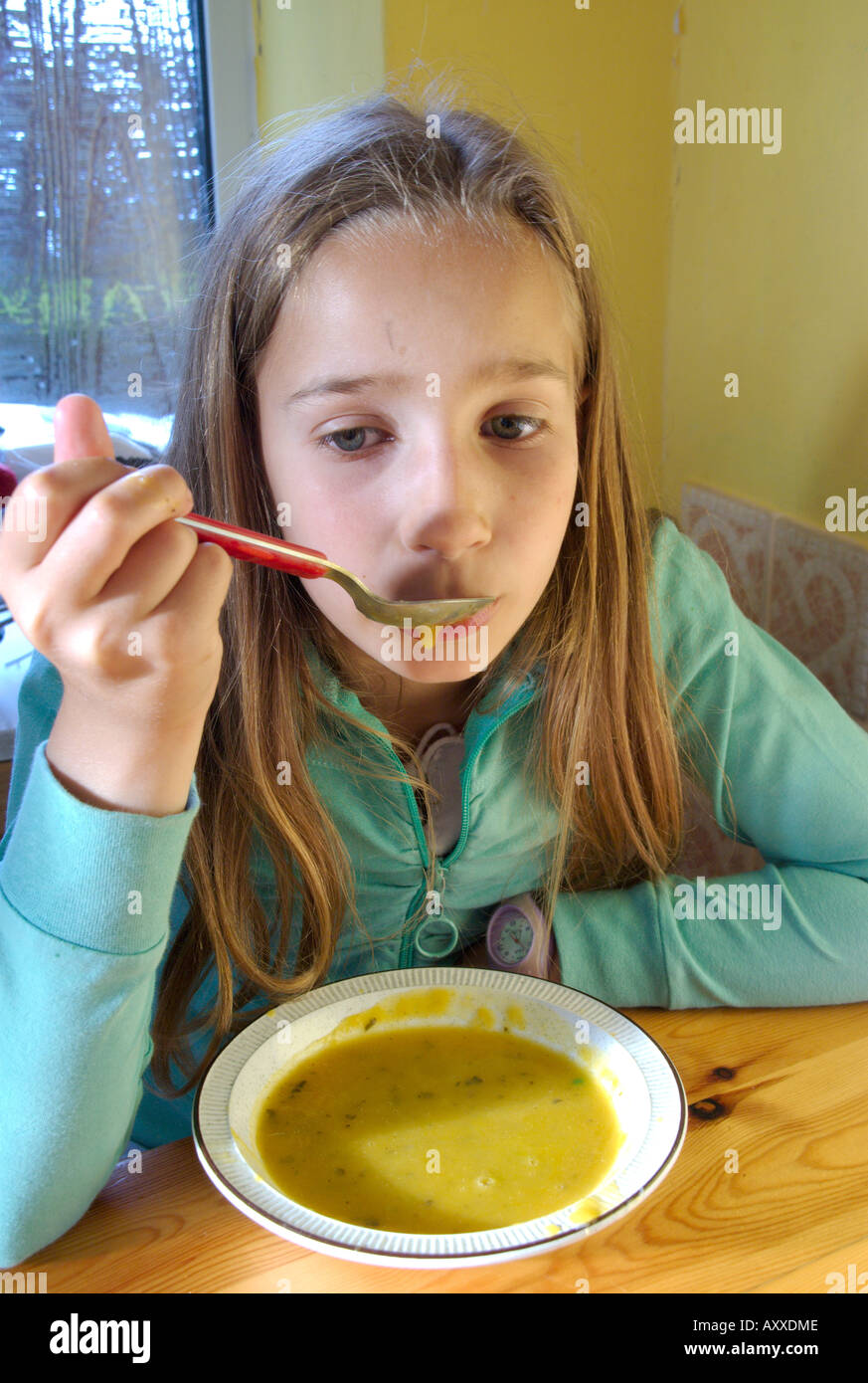 girl child drinking soup Stock Photo - Alamy