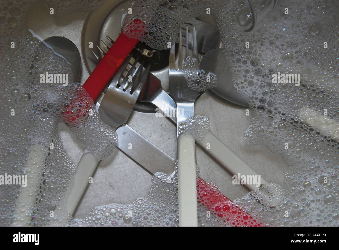washing up bowl with utensils Stock Photo - Alamy