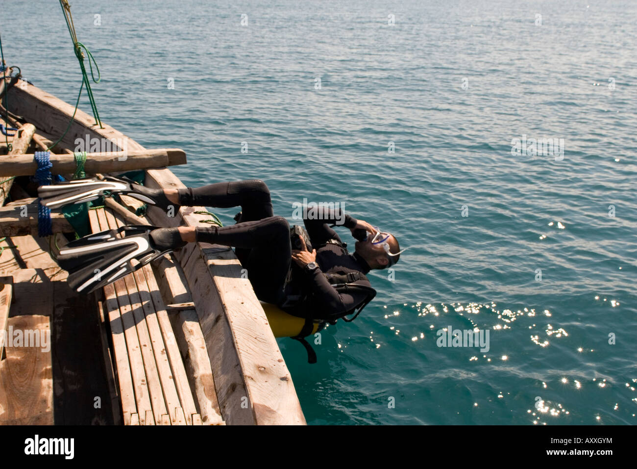 Scuba diver entering water in Chole Bay off Mafia Island Tanzania Stock ...