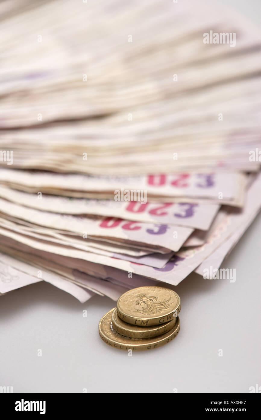 Wad of £20 pound notes and pound coins Stock Photo - Alamy