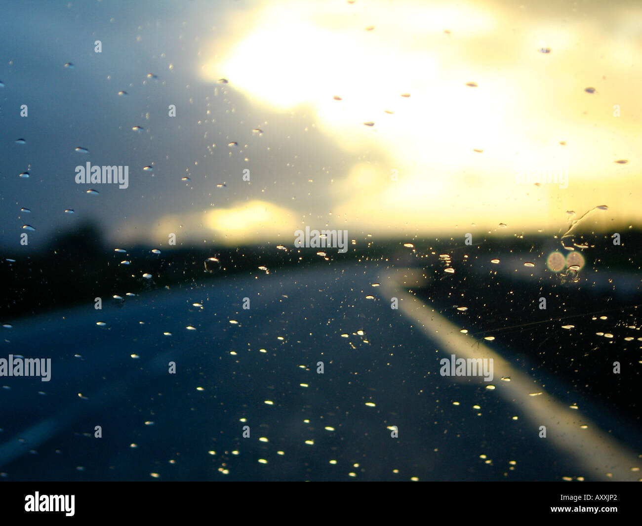 Road viewed through rain spattered windscreen Stock Photo - Alamy