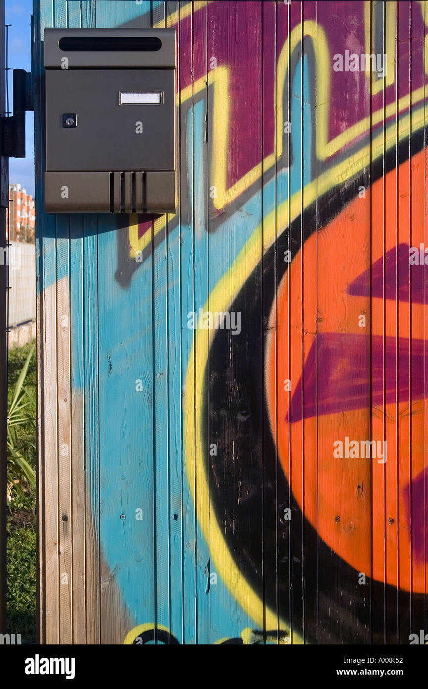post box and graffiti covering a locked door Stock Photo - Alamy