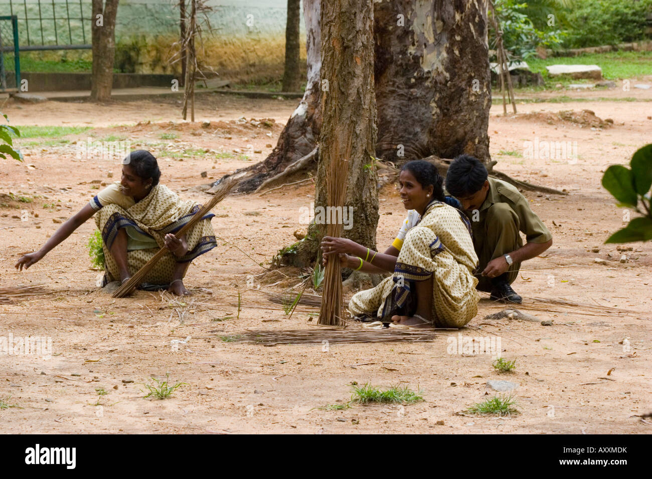 Indian ladies cleaning with home made brushes and brooms Stock Photo ...