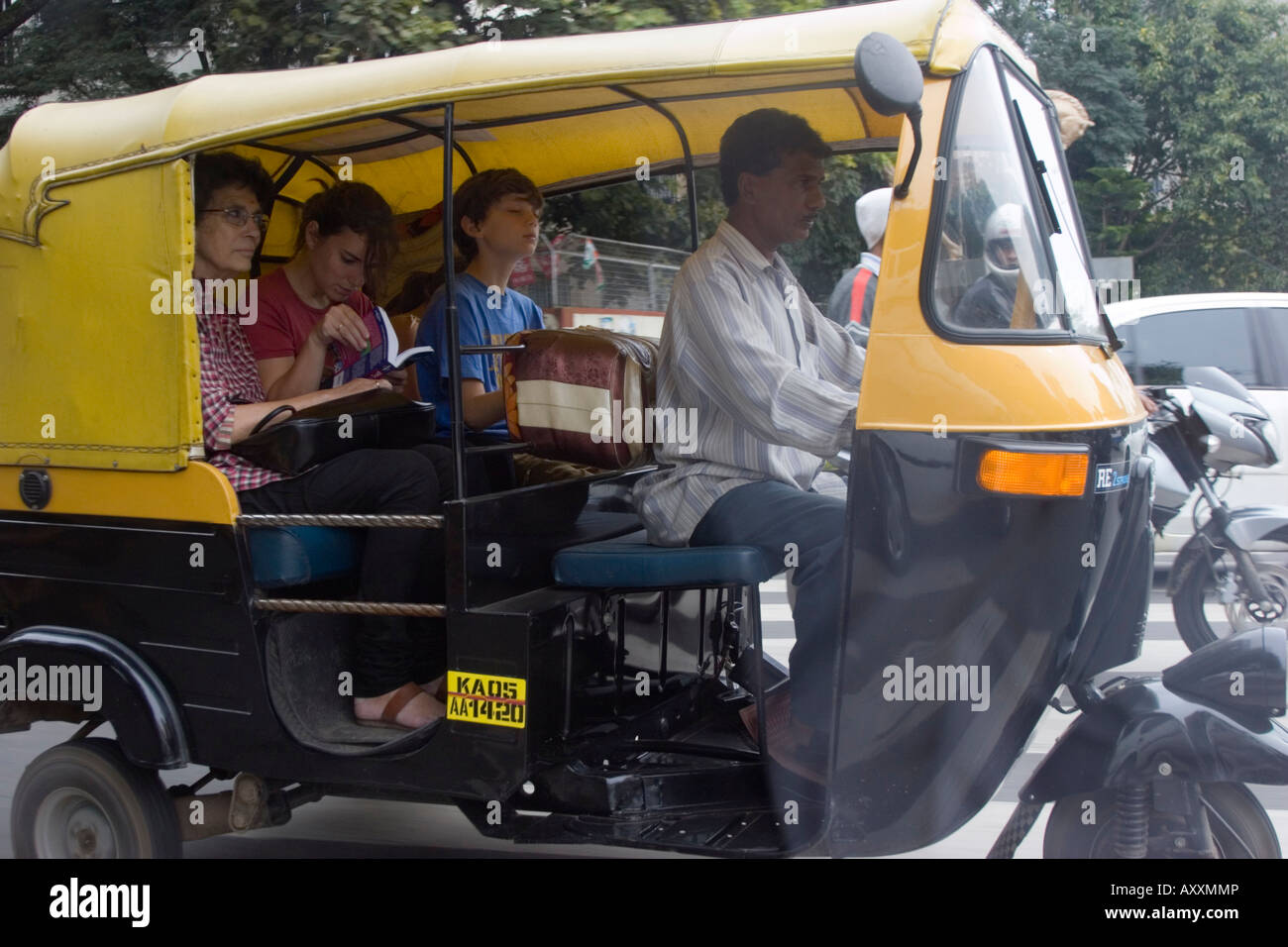 Autorickshaw passengers and driver Stock Photo - Alamy