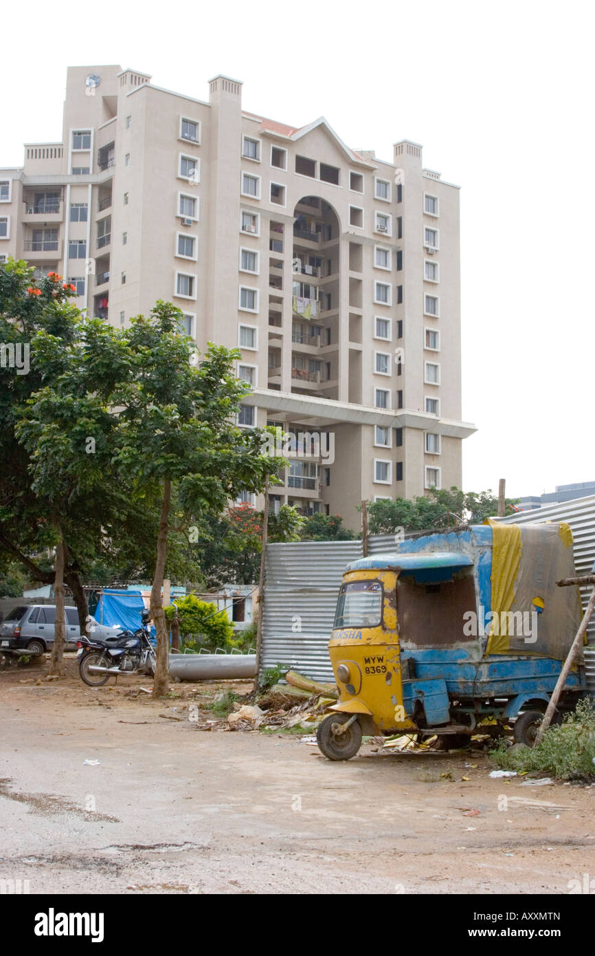 Neglected and tatty auto rickshaw parked by the side of the road in ...