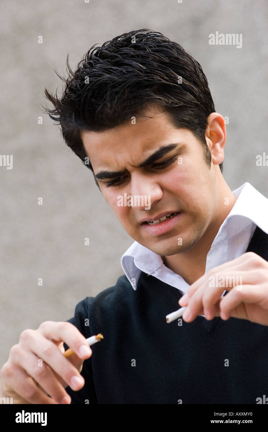 Man breaking cigarettes not woman hi-res stock photography and images ...