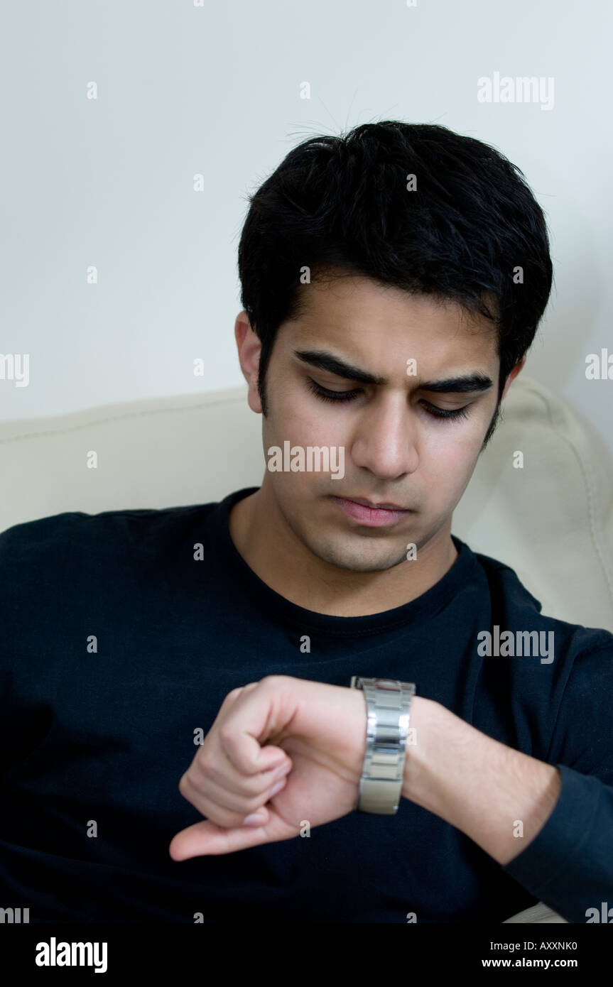 Teenage boy waiting time watch hi-res stock photography and images - Alamy