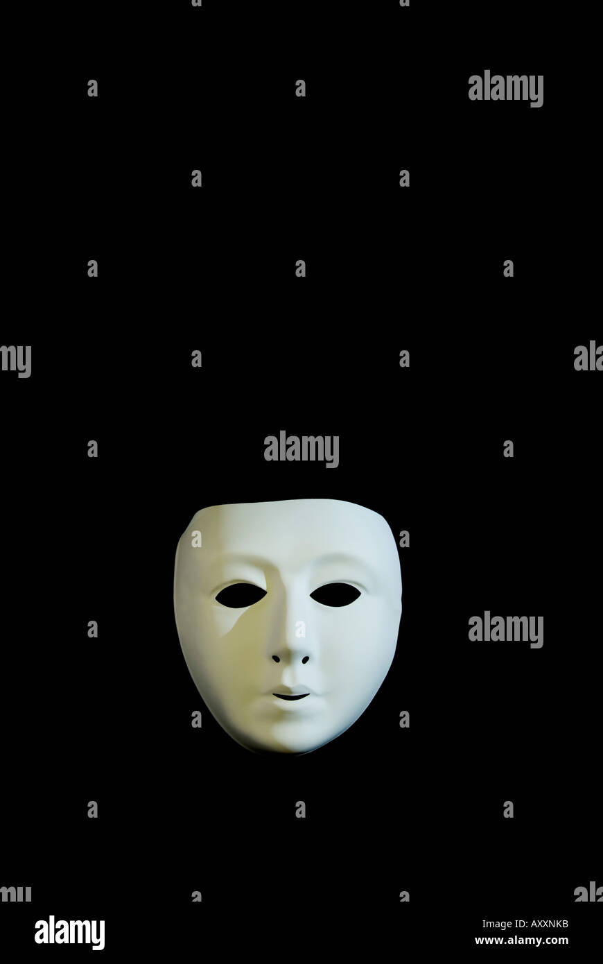 white mask on black background Stock Photo - Alamy
