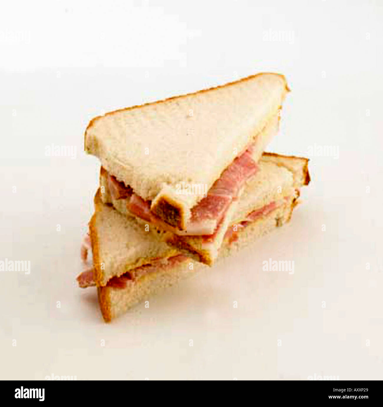 simple ham sandwich on white bread on white background Stock Photo - Alamy