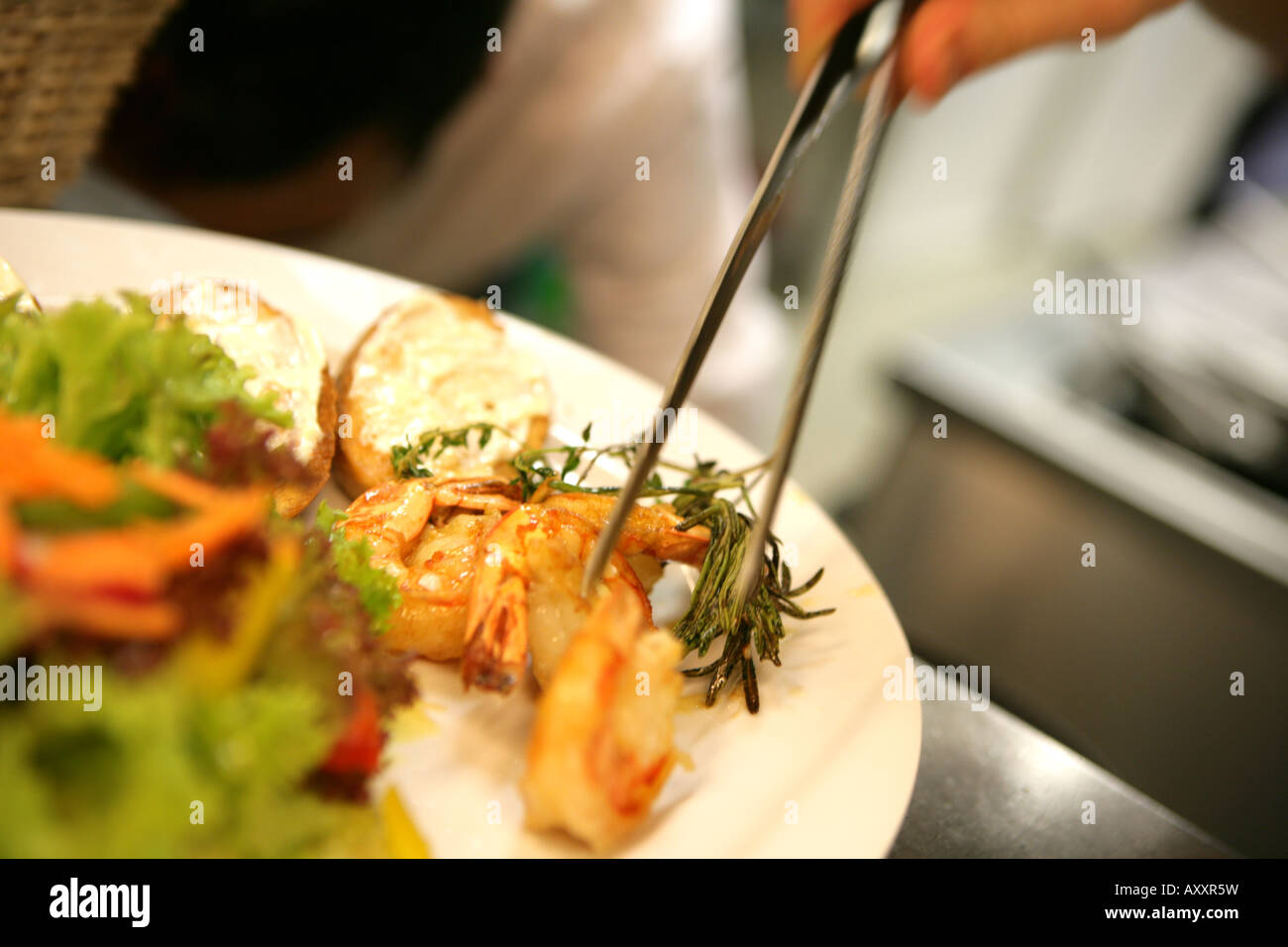 Kitchen of a Restaurant Decoration of plates with a s dish, seafood ...