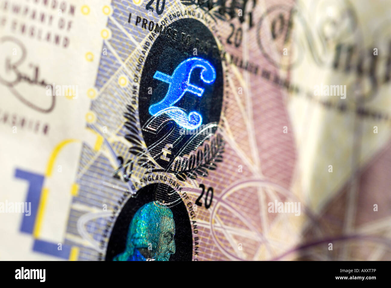 close up of twenty pound note focusing on hologram symbol horizontal ...