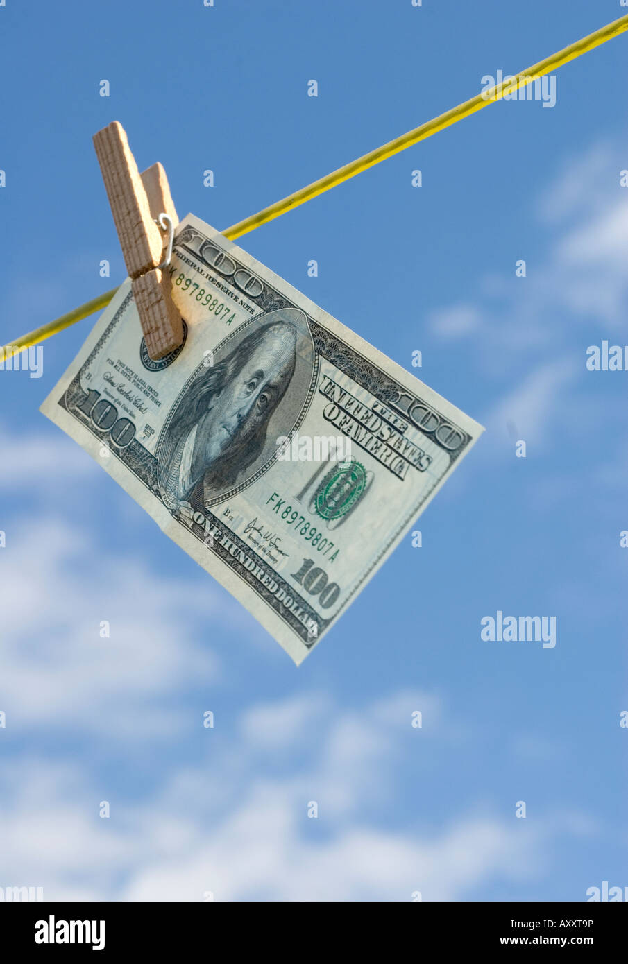 hundred dollar bill on washing line vertical Stock Photo - Alamy