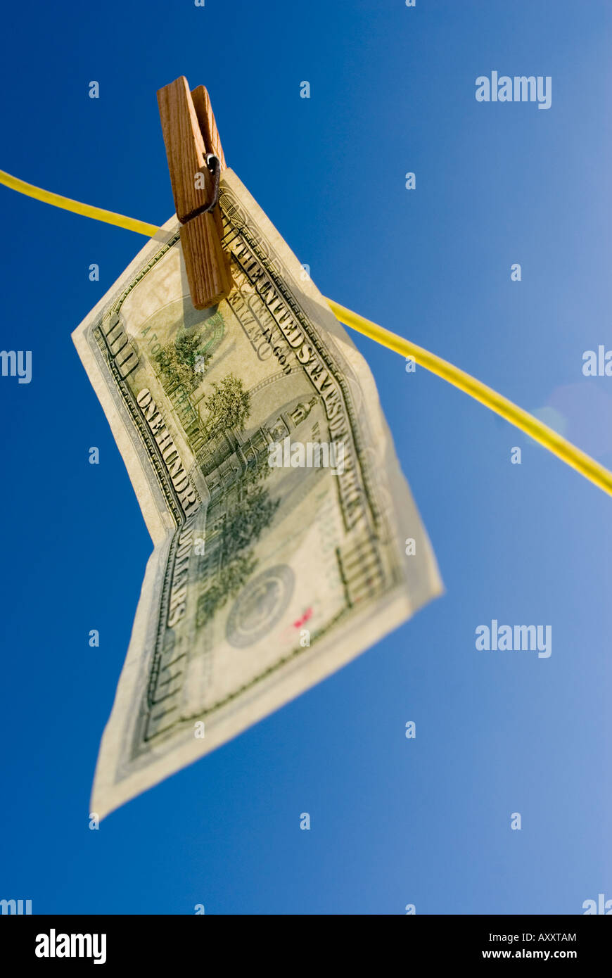 hundred dollar bill on washing line vertical Stock Photo - Alamy